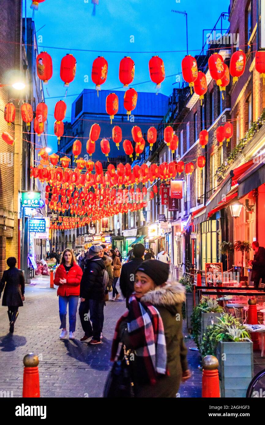 Shoppers and tourists in Lisle Street in Chinatown, Soho, London, UK ...
