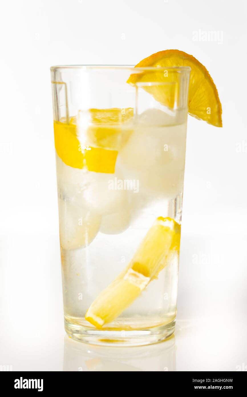 Glass of water with ice and slices of lemon on a white background Stock ...