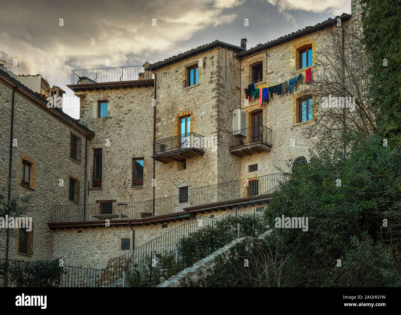 Glimpse with ancient tall stone houses. Isola del Gran Sasso, Teramo ...