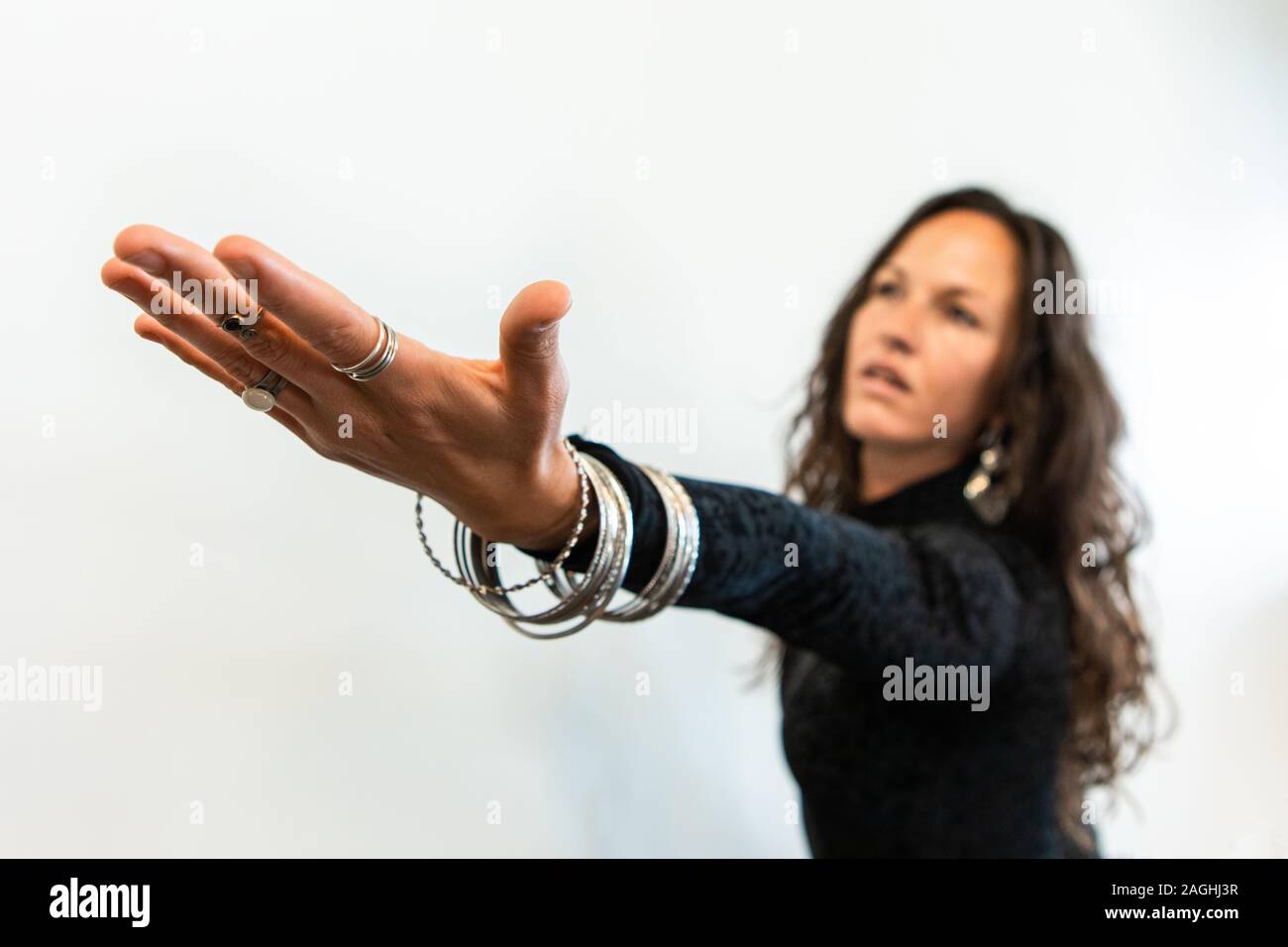 A selective focus shot as an adult female practices spiritual and ...