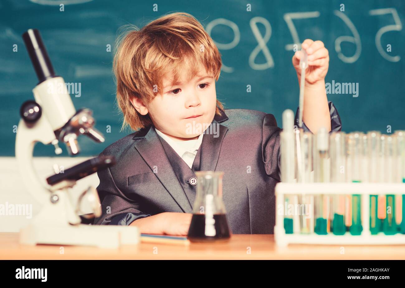 Biology school laboratory equipment. Little boy in the laboratory ...