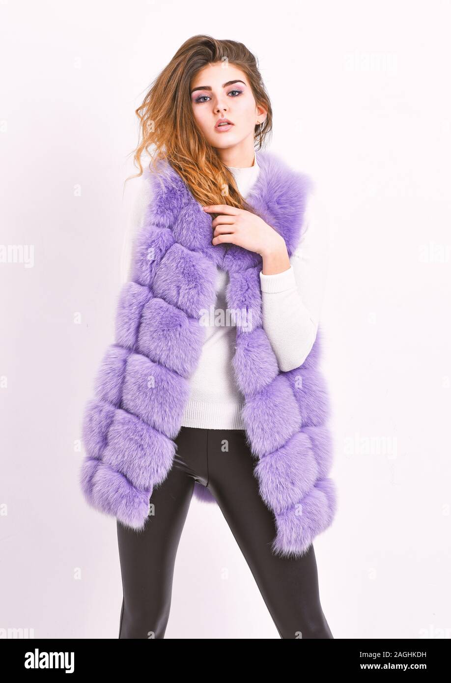 Boutique selling fur. Woman makeup face wear fur vest white background ...