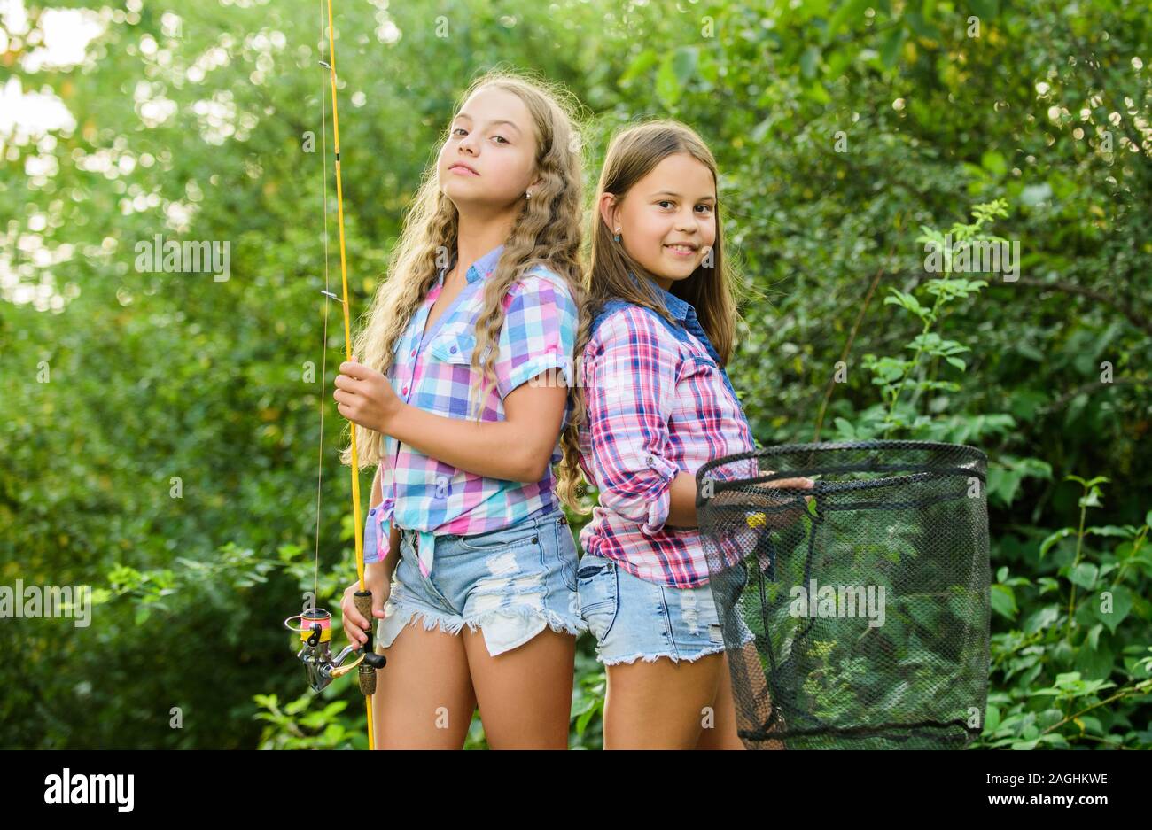 Camping activities. Fly fishing. Kids spend time together fishing ...