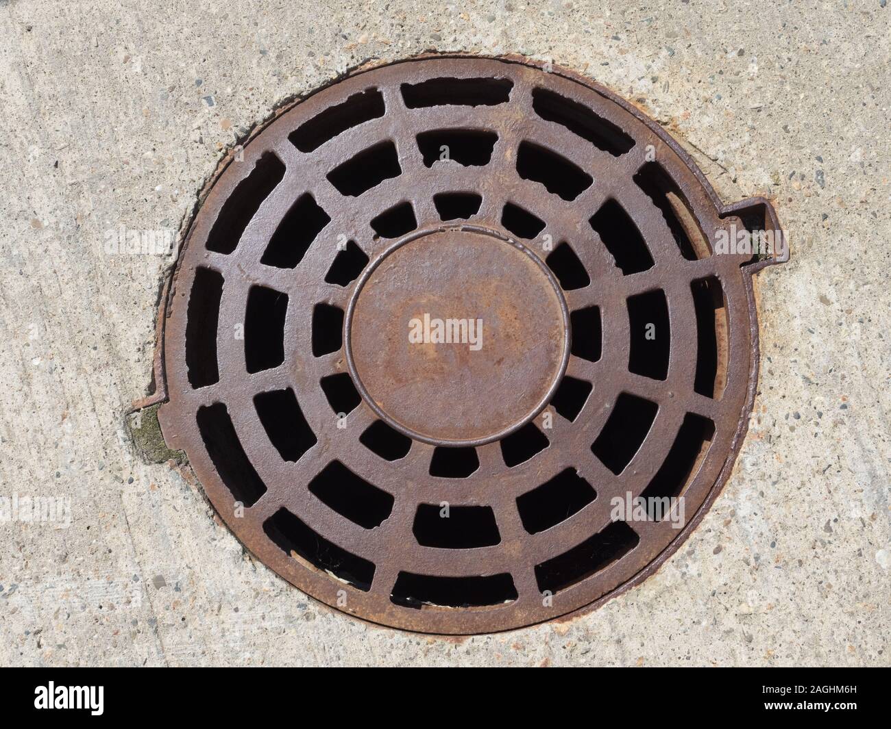 Sewer iron hatches in concrete Rosa Khutor Stock Photo - Alamy