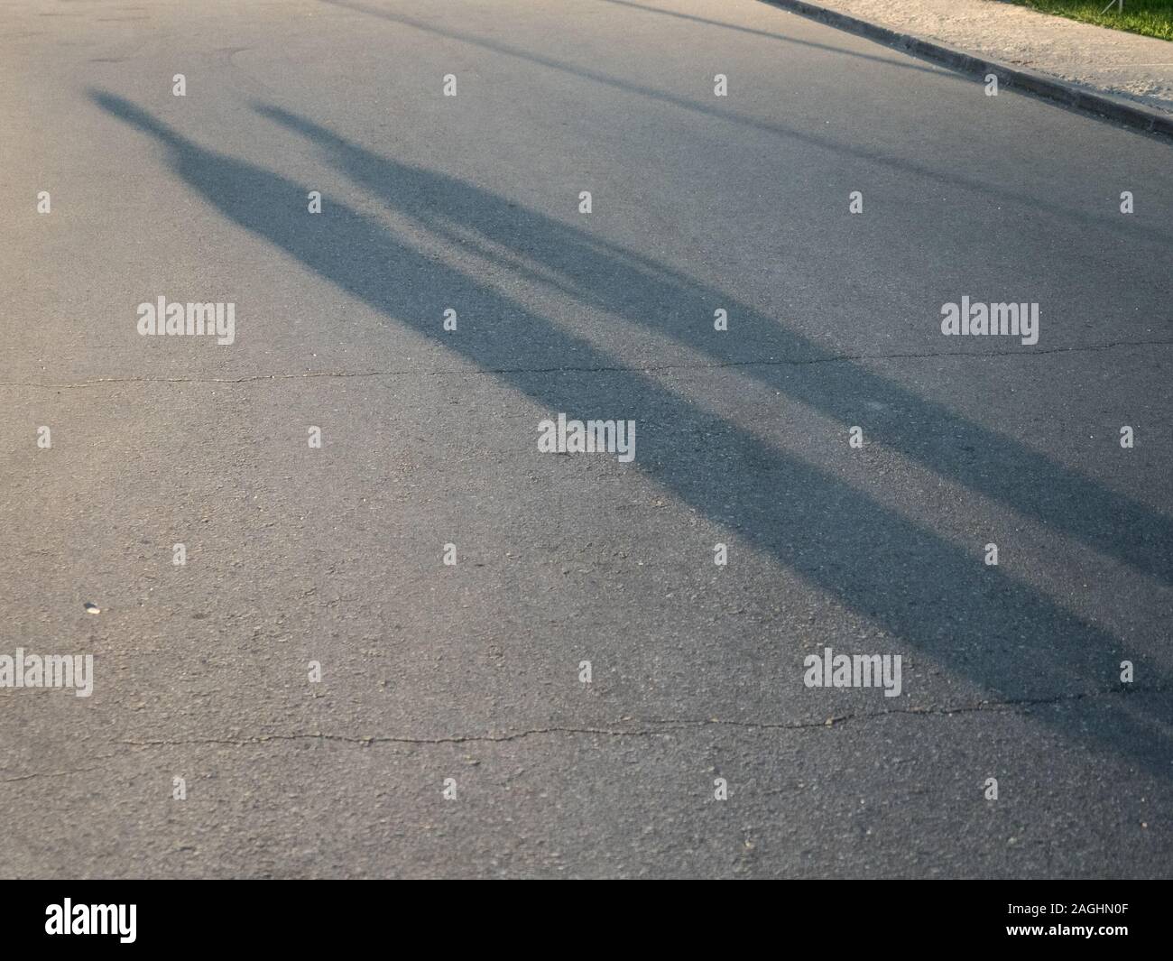 Two human shadows on street hi-res stock photography and images - Alamy