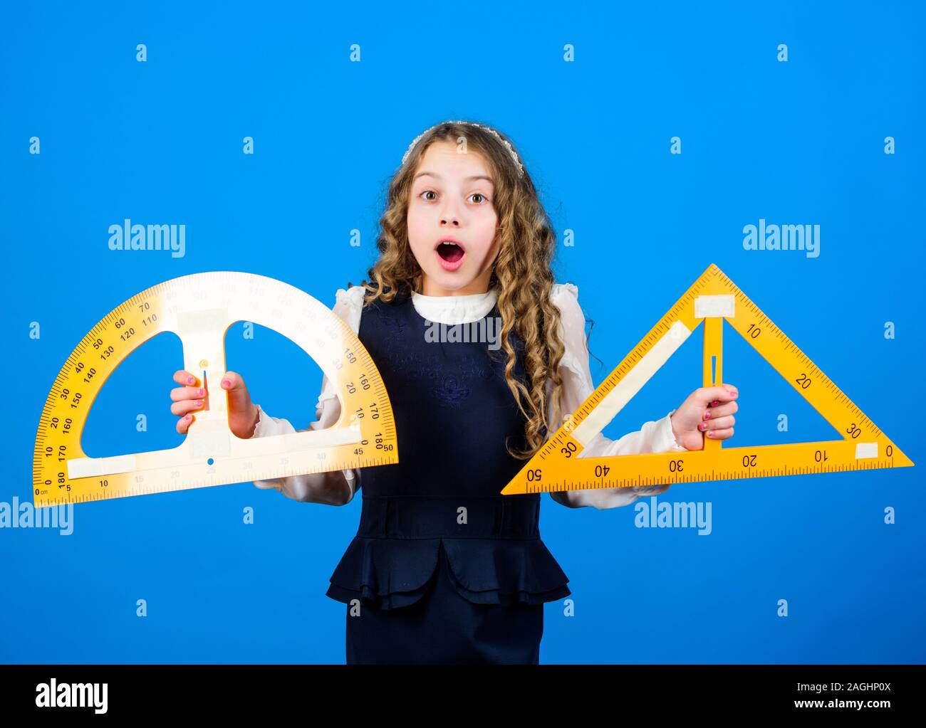 School student learning geometry. Pupil girl with big rulers. STEM ...