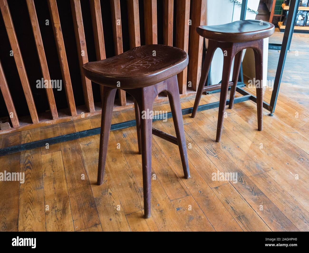 Two beautiful bar stools made of wood in cafe Stock Photo - Alamy