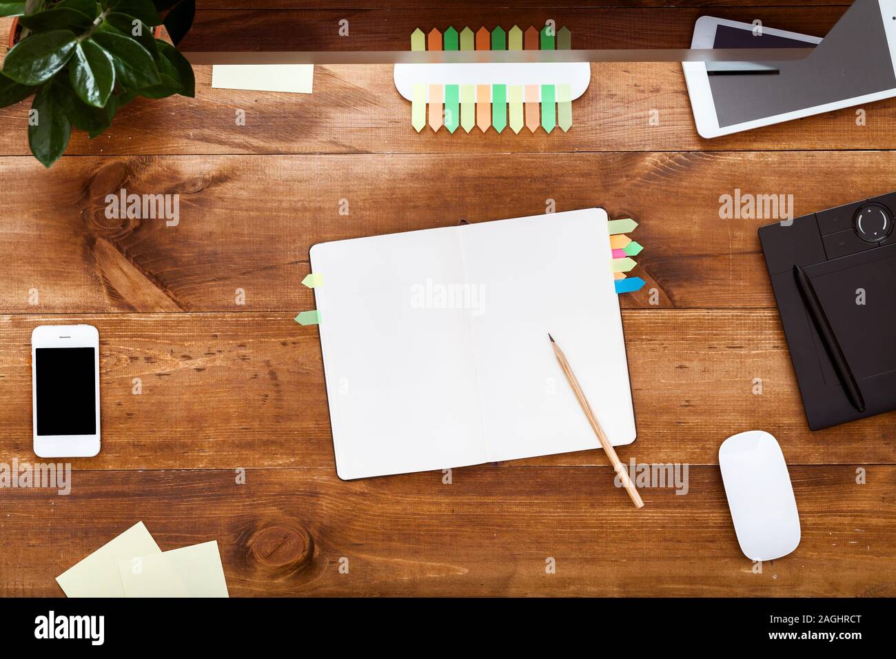 Modern workstation table with open empty blank notebook organizer with ...