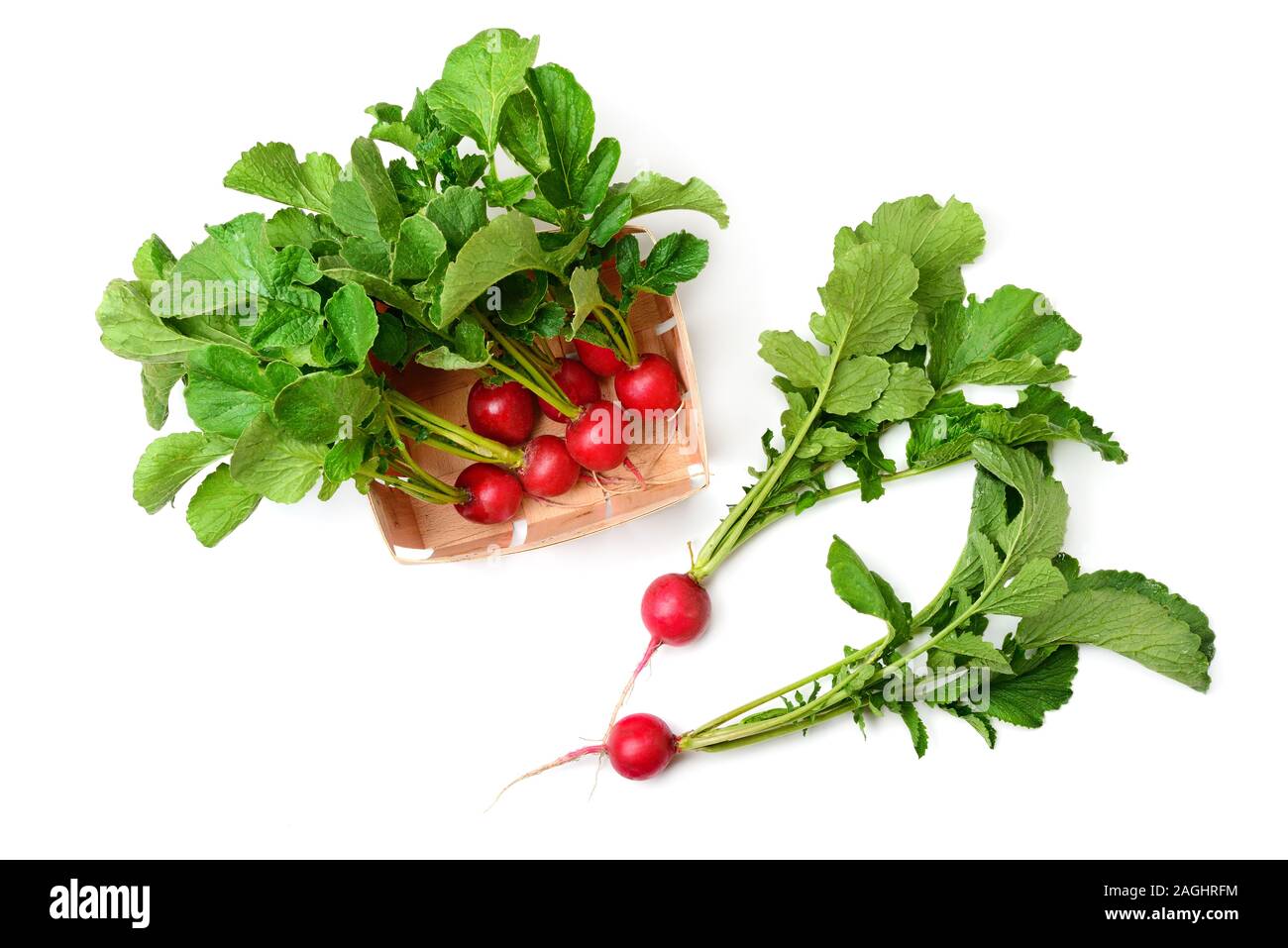 Radish in a basket isolated on a white background Stock Photo - Alamy