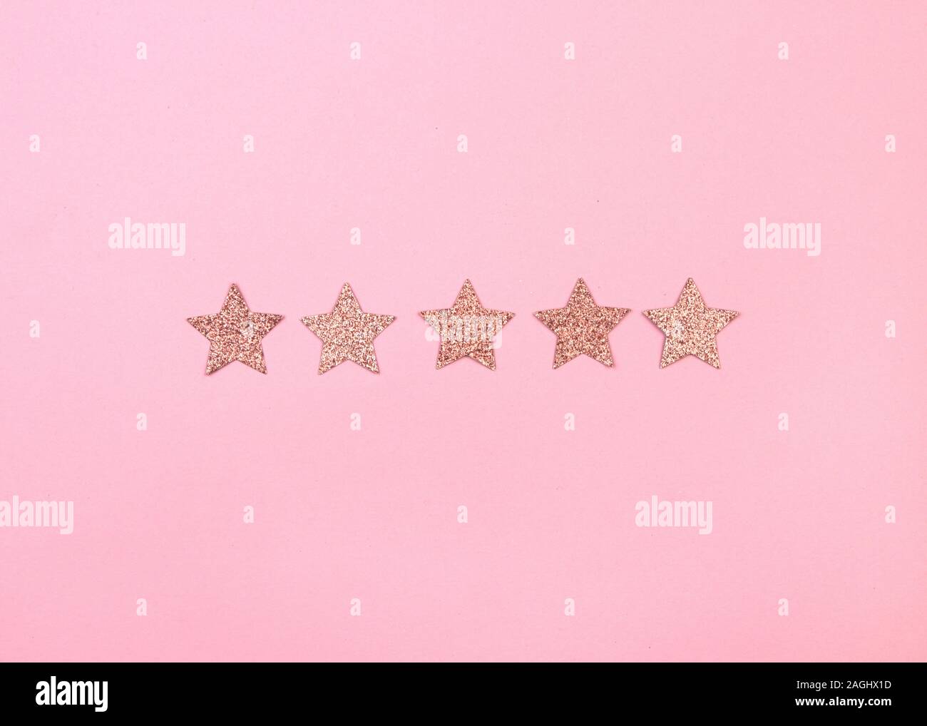 Five Star Rating on pink background. Beige glitter stars Stock Photo ...
