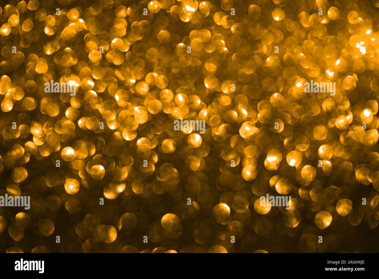 Abstract yellow saffron defocused bokeh glitter sparkle confetti burst ...