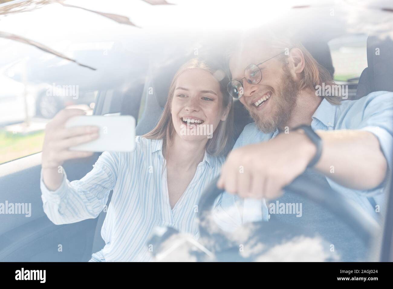 Transportation. Young couple traveling by electric car boyfriend ...