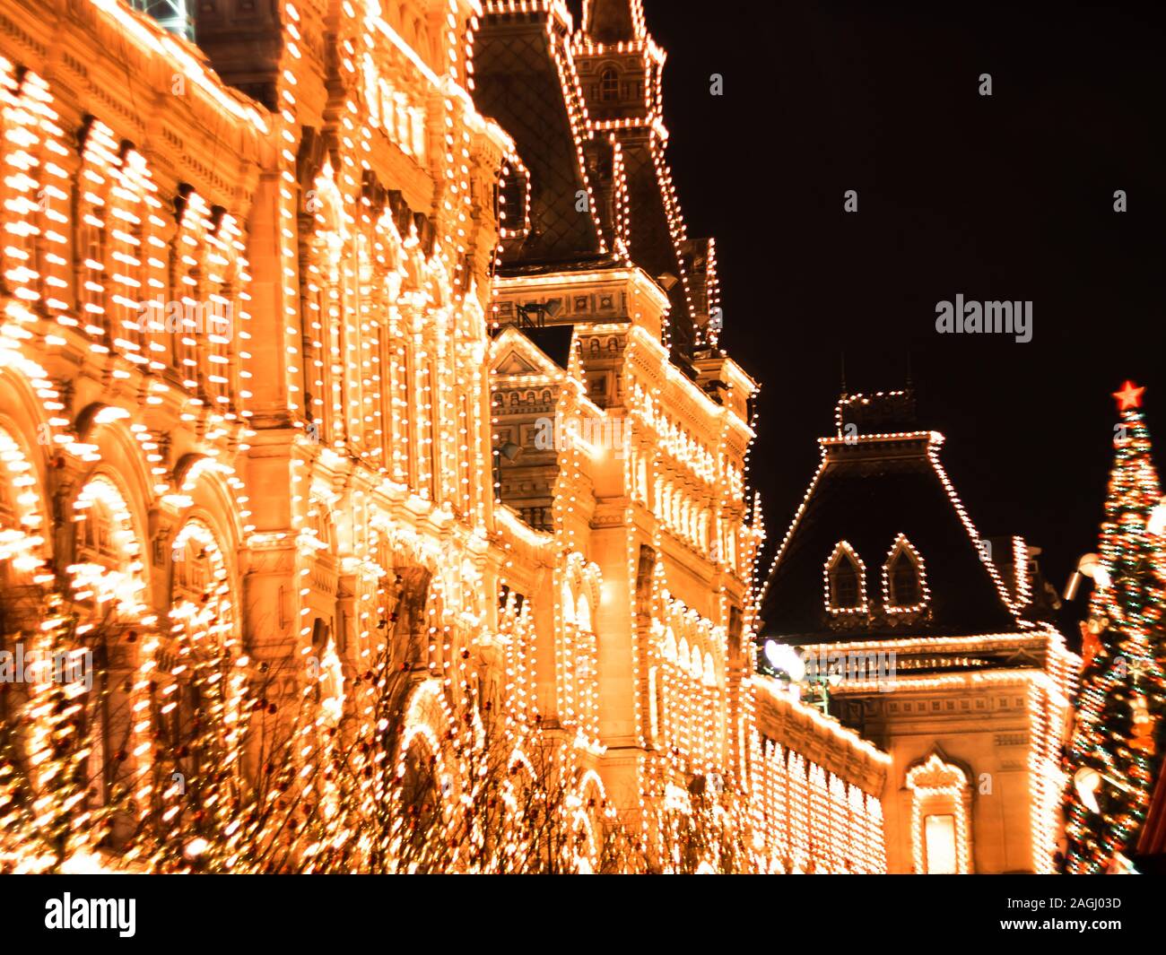 Illuminated lights on facade of GUM Festive background. Christmas ...