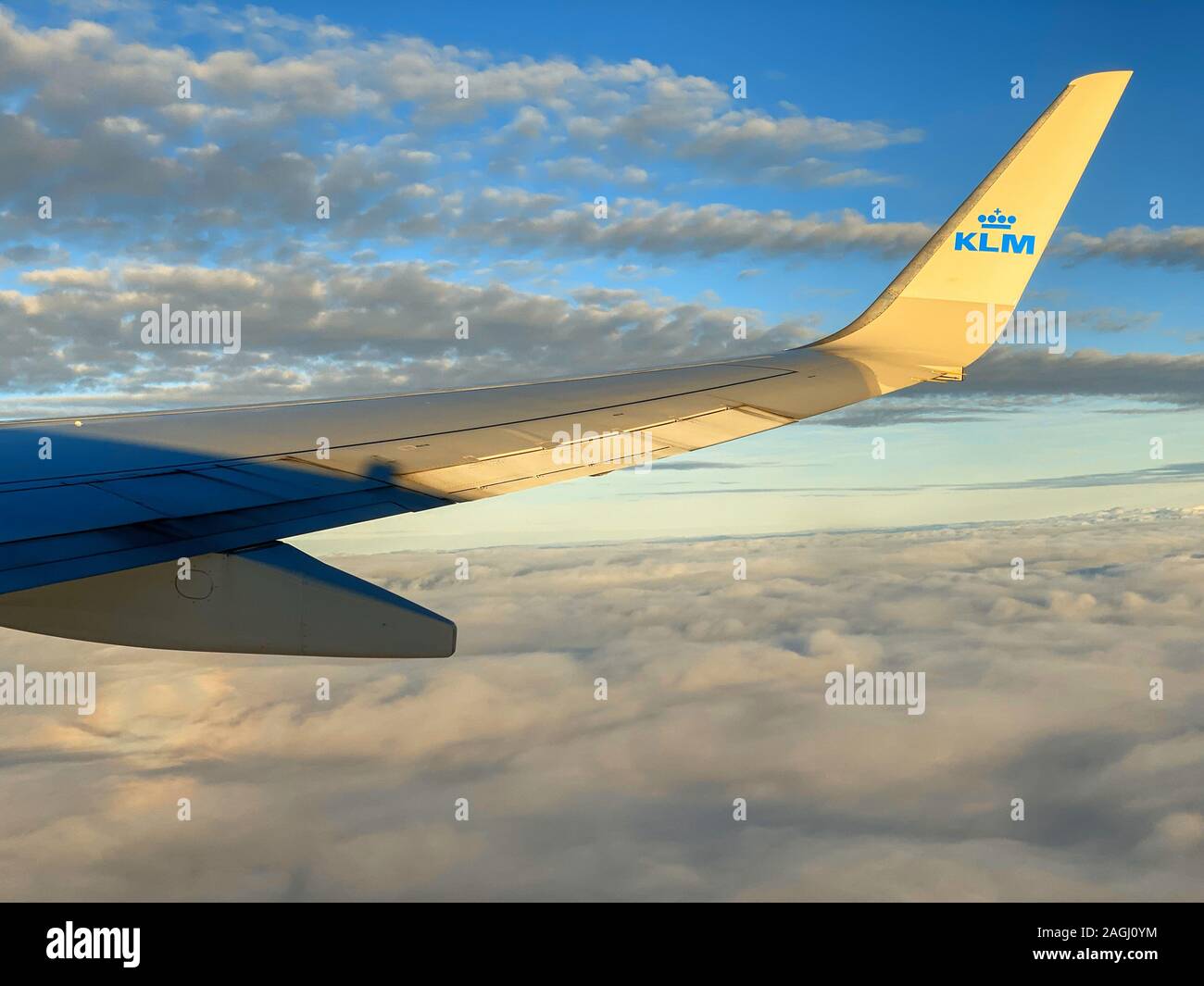 Flight over clouds from above by plane Stock Photo - Alamy