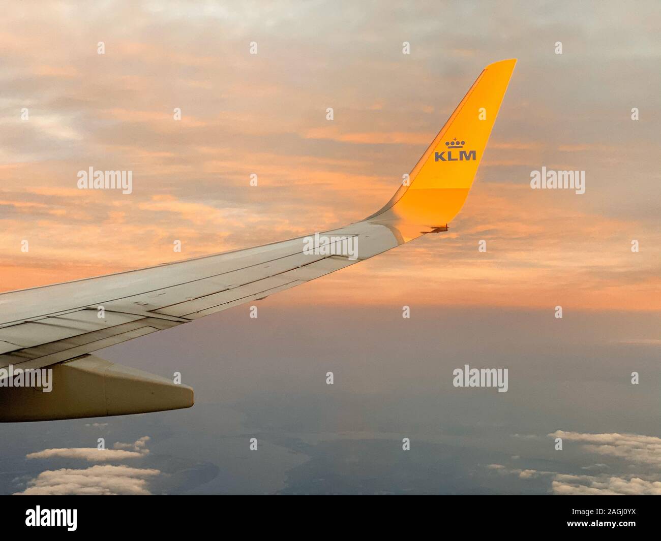 Flight over clouds from above by plane Stock Photo - Alamy