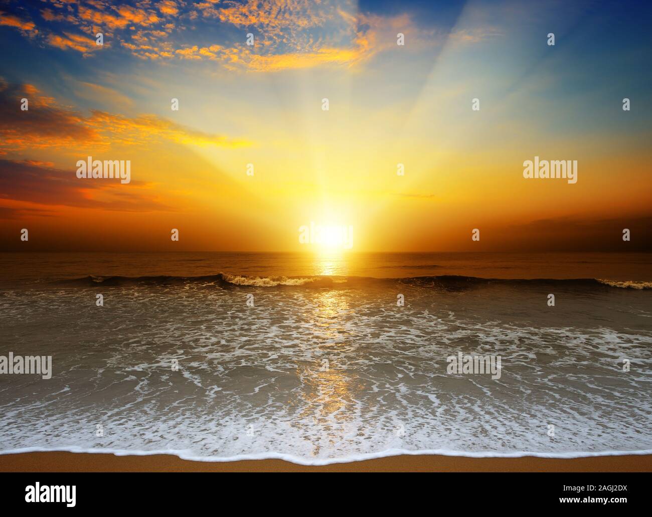 Fantastic sunset over ocean, sea waves and sand Stock Photo - Alamy