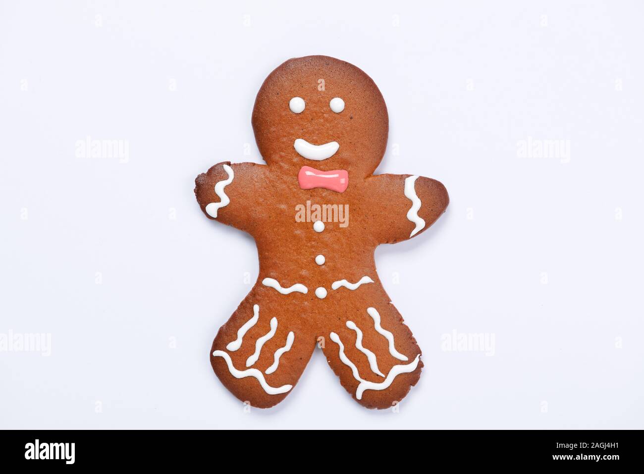 The hand-made eatable gingerbread little man on white background Stock ...