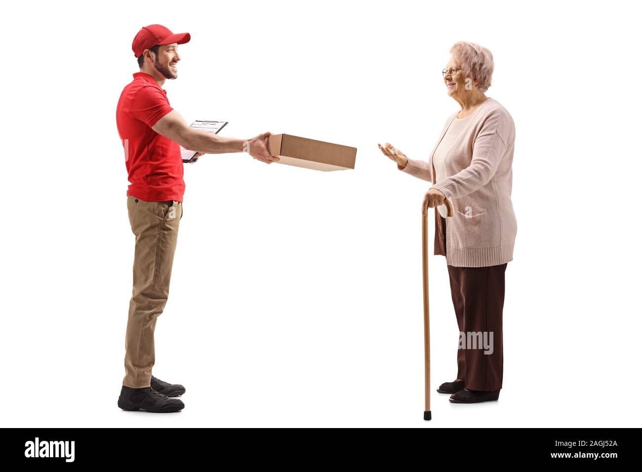 Full length portrait of a delivery man giving a package to an older ...