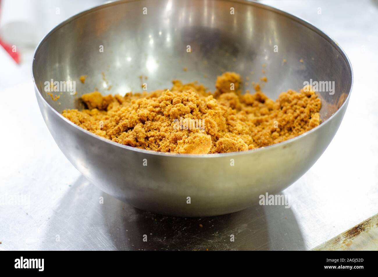 chef cooking table and pot prepared cookie crumbs for waffles Stock ...