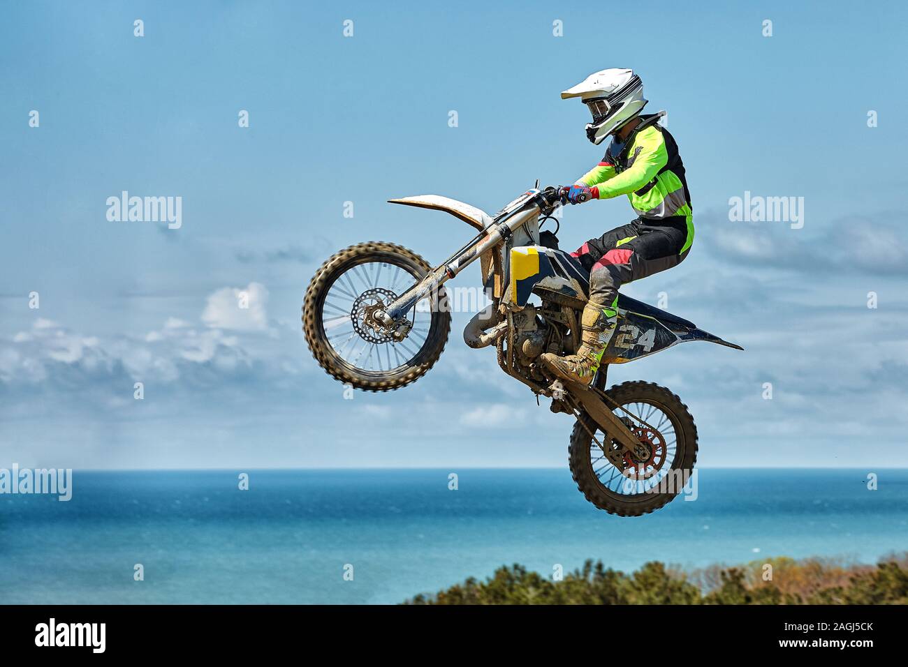 Extreme sports, motorcycle jumping. Motorcyclist makes an extreme jump ...