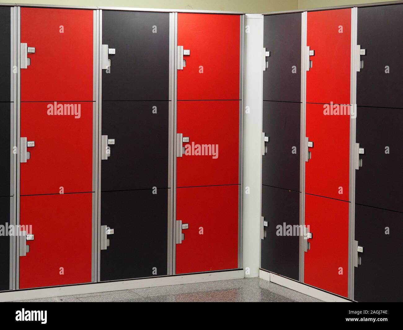 Contrasting stripes and geometric shapes of red and black lockers under ...