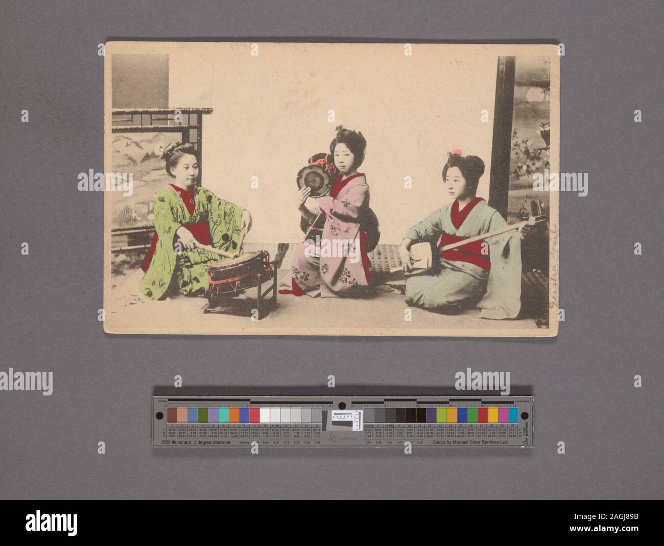 Maiko playing musical instruments.; Maiko playing musical instruments ...