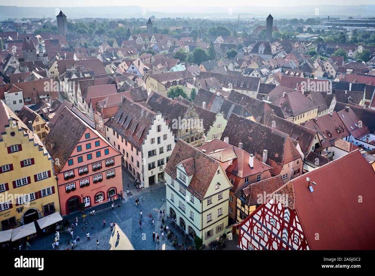 Bird's eye view onto the red roof tops of Medieval village square of ...