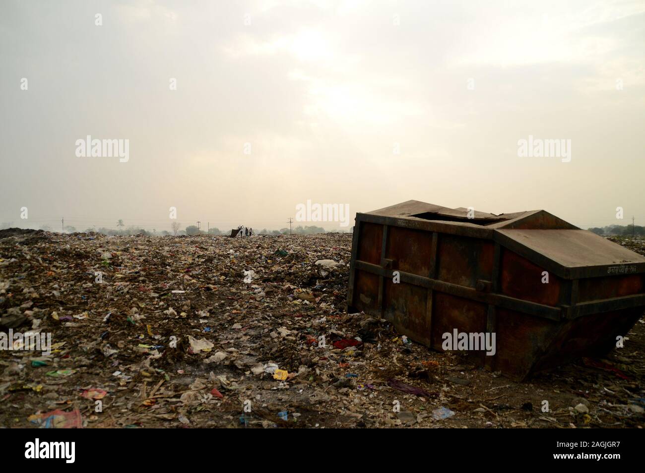 Big garbage land. Land and air pollution Stock Photo - Alamy
