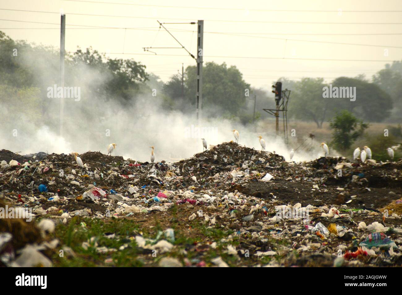Big garbage land. Land and air pollution Stock Photo - Alamy