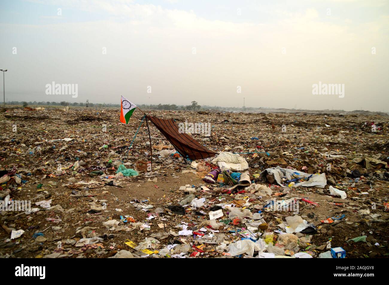 Big garbage land. Land and air pollution Stock Photo - Alamy
