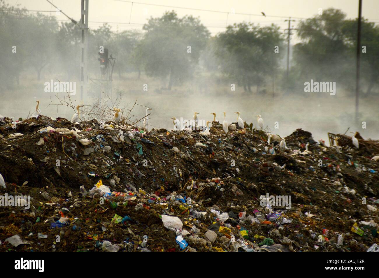 Big garbage land. Land and air pollution Stock Photo - Alamy