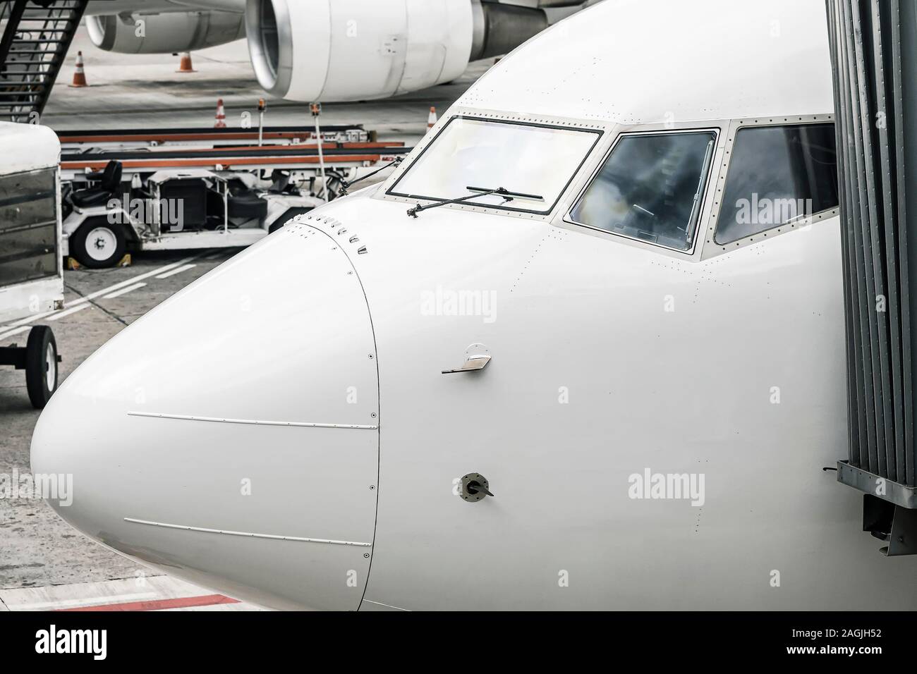 Close up on the cockpit of an airplane at the airport. Outside view of ...