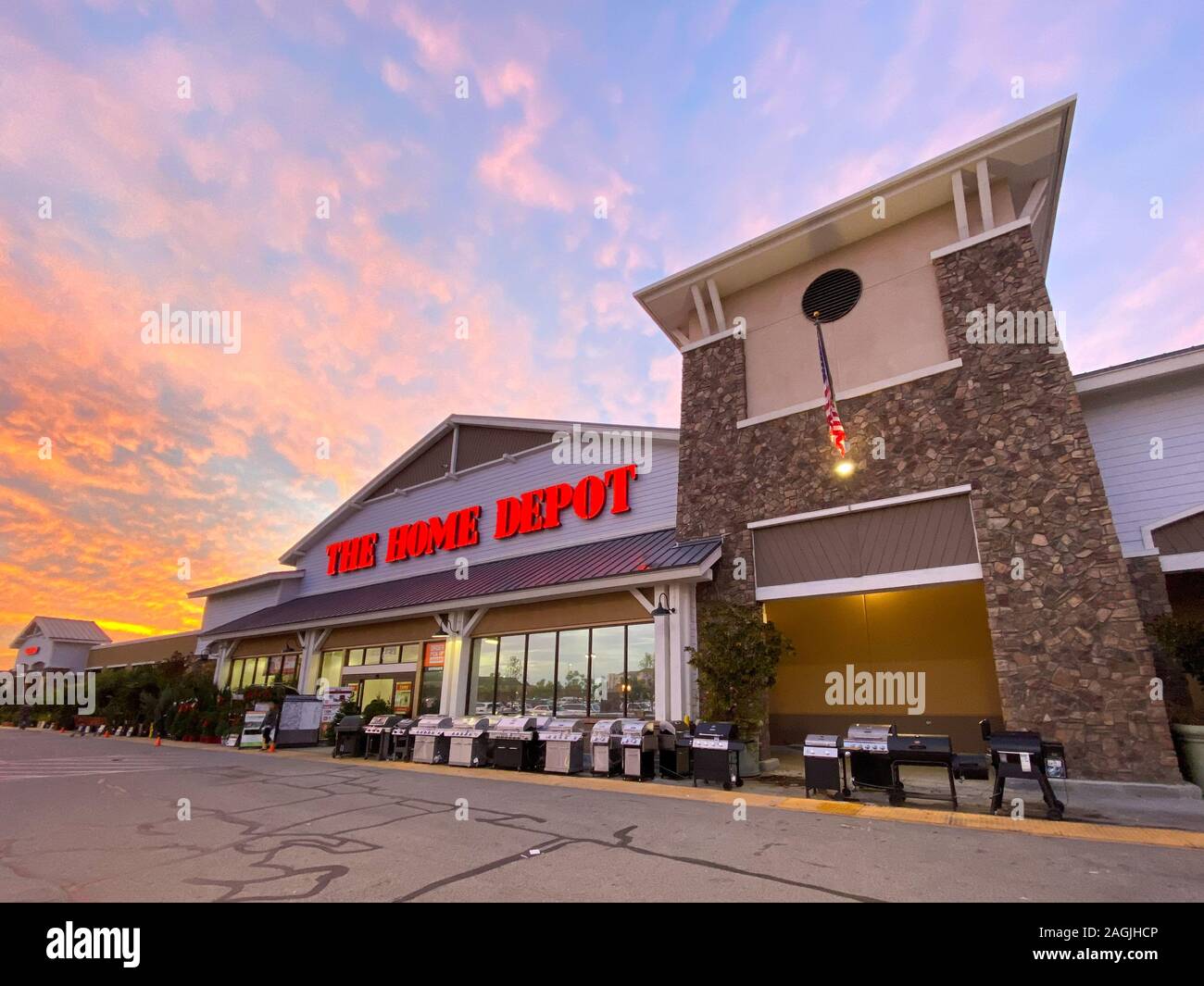 The Home Depot store entrance with colorful sunset in the background in Irvine California USA. Largest home improvement retailer and construction service in the US. November 22nd 2019 Stock Photo Alam...