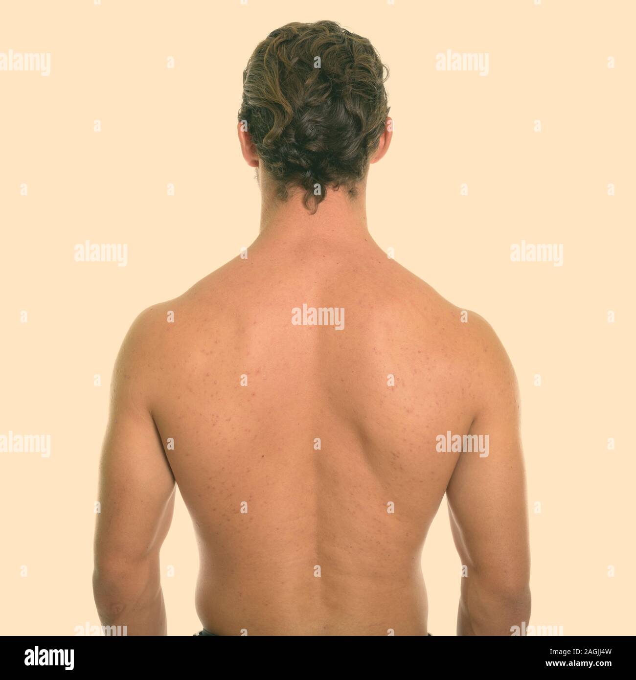 Back view of young handsome man shirtless isolated against white ...