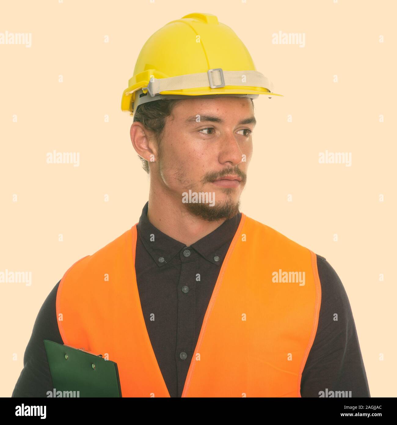Close up of young handsome man construction worker thinking while ...