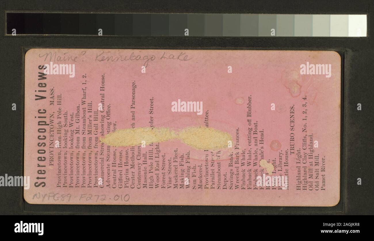 Men with fishing poles, rifles and pistols posed outside a log cabin at ...