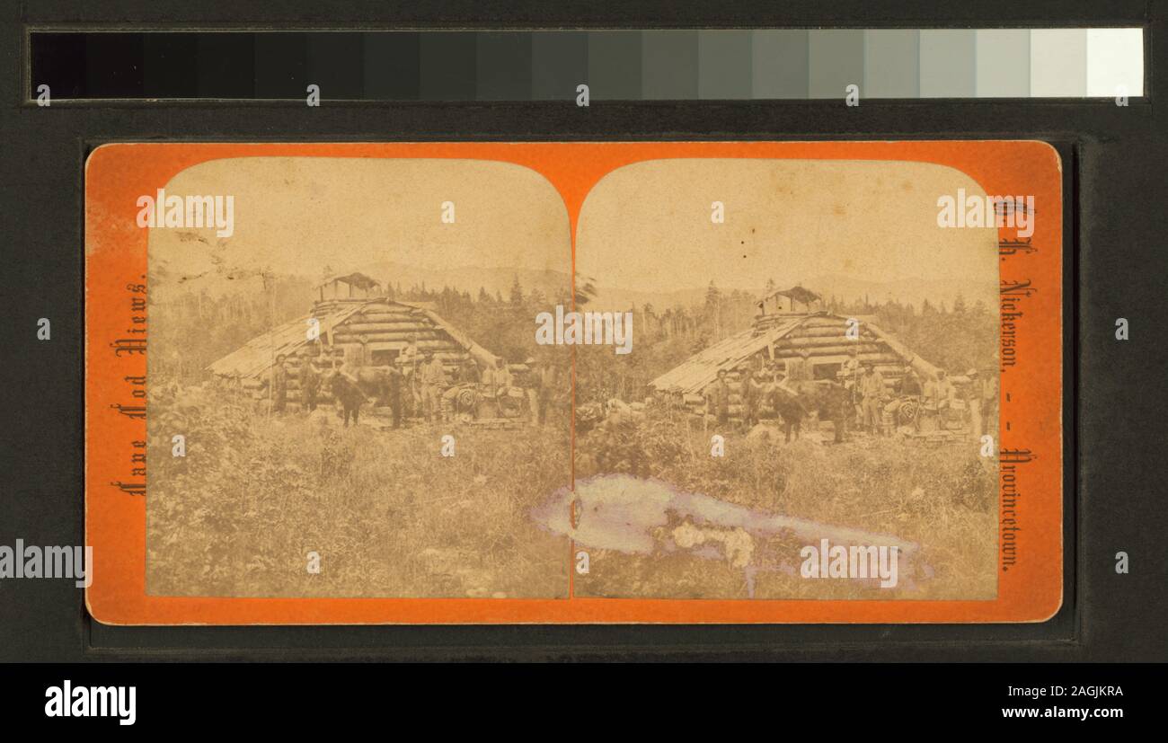 Men with fishing poles, rifles and pistols posed outside a log cabin at ...