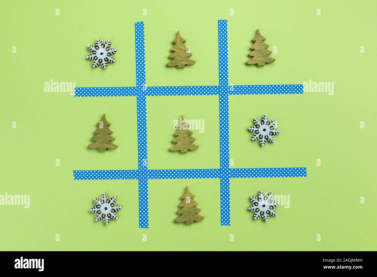 Tic tac toe game with christmas toys, isolated on green background ...