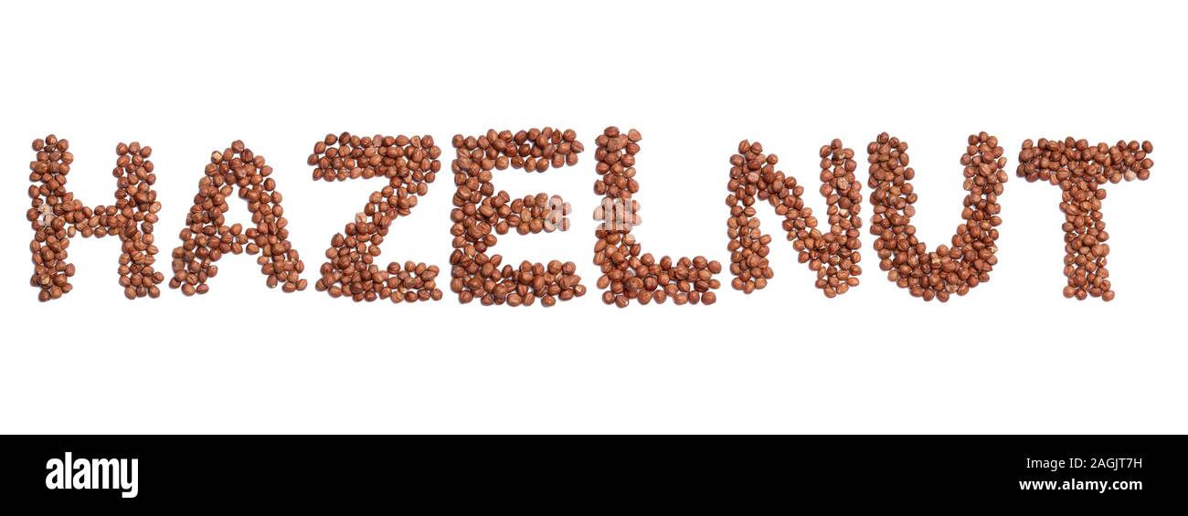 Inscription "Hazelnut" of the English alphabet from a peeled hazelnuts ...
