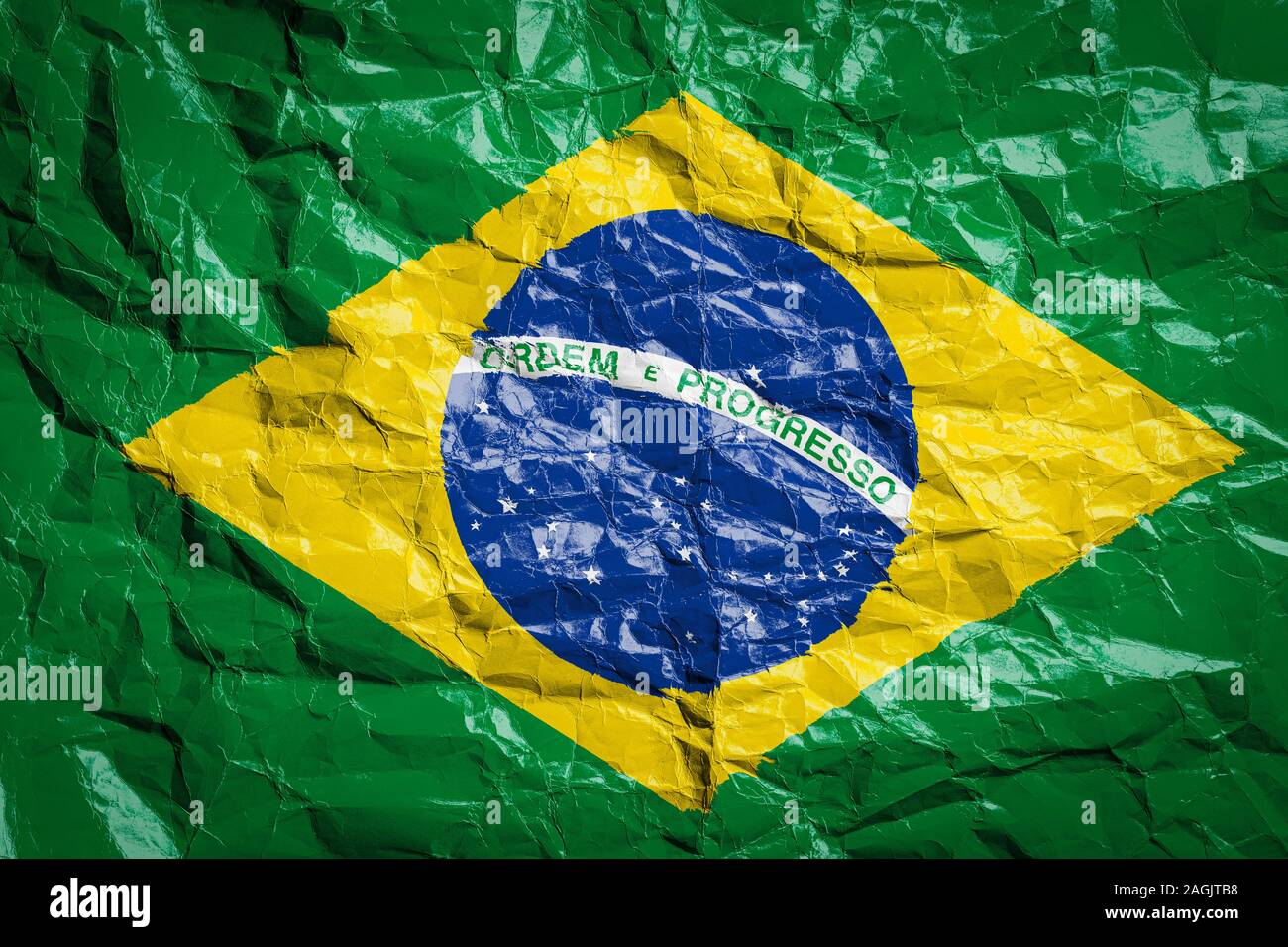 National flag of Brazil on crumpled paper. Flag printed on a sheet ...