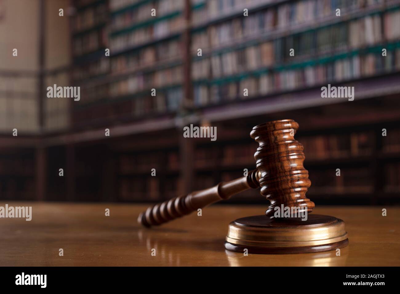 Law and justice theme. Gavel of the judge on court library background ...