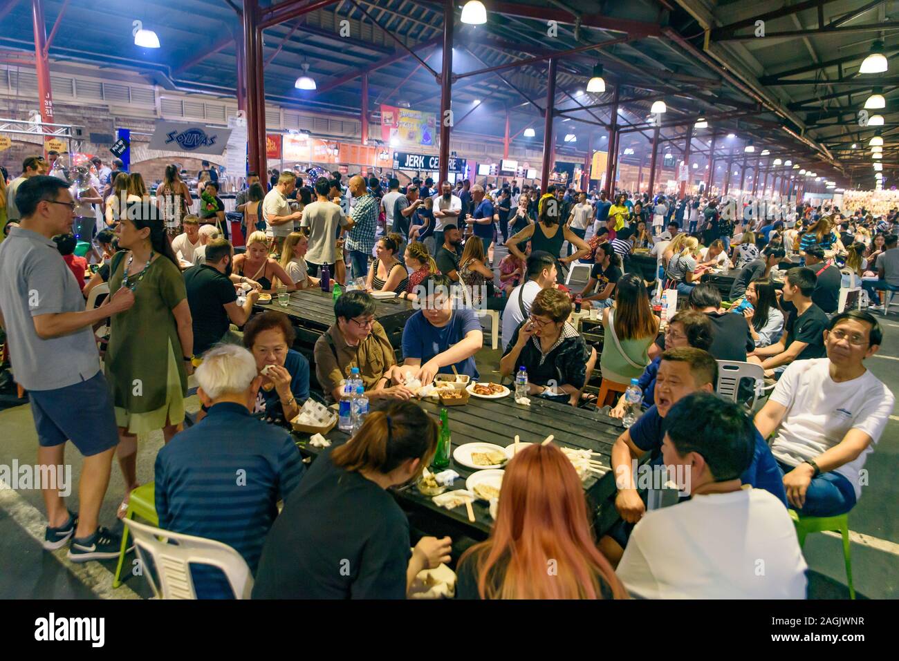 People enjoying food and drink in Queen Victoria Night Market for ...