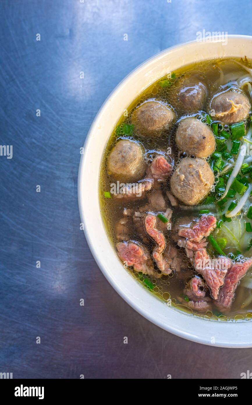 Typical Pho bowl served at Vietnamese street food vendor Stock Photo ...