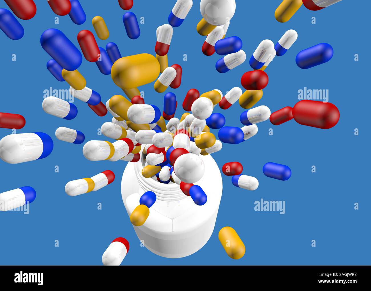 Close up from above of group of yellow, blue and red medicine capsules ...