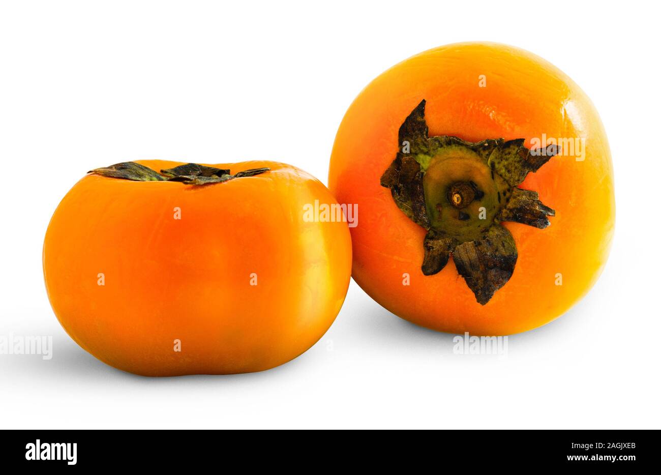 Pair of ripe persimmon fruits isolated on white background. Two whole ...