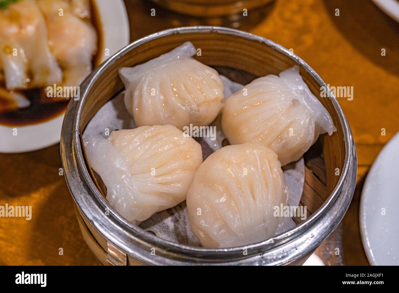 Crystal shrimp dumpling- xia jiao in bamboo dimsum steamer box Stock ...