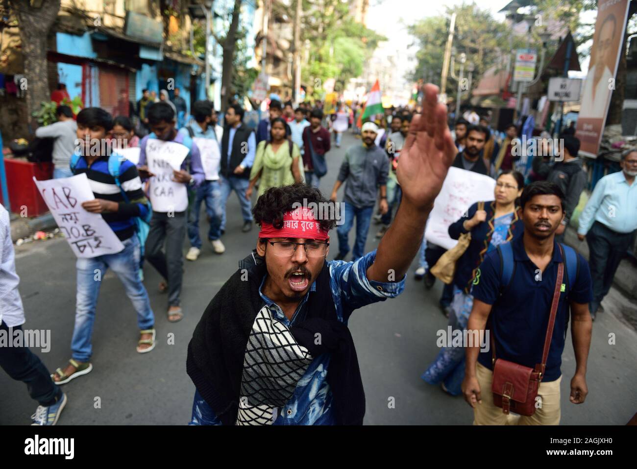 Protesters marching while shouting slogans during the demonstration.The ...