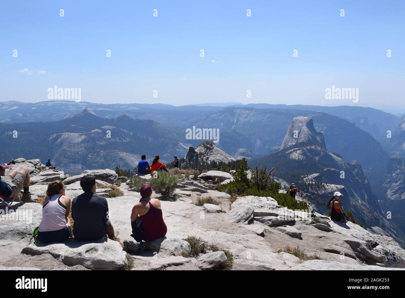 Hikers ending their journey at the summit of Clouds' Rest, the terminus ...