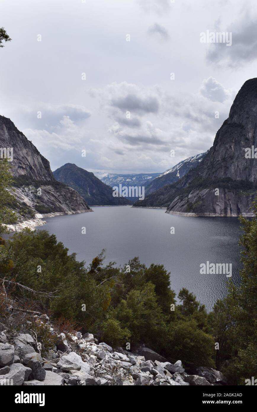 View of the Hetch Hetchy Reservoir. Towering granite mountains remind ...