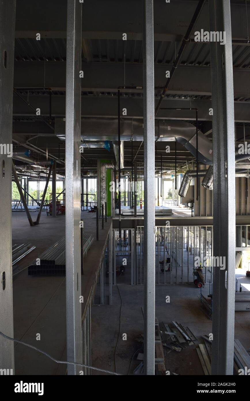 Metal-framed building under construction. Structure has mostly been ...